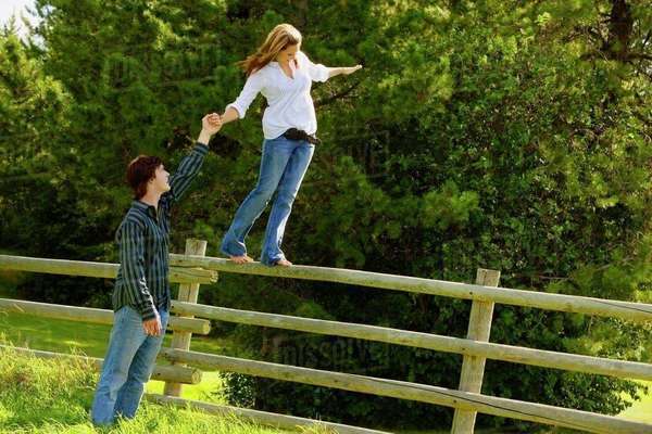 Balancing On Fence Rail - Royalty-free Stock Photo | Dissolve