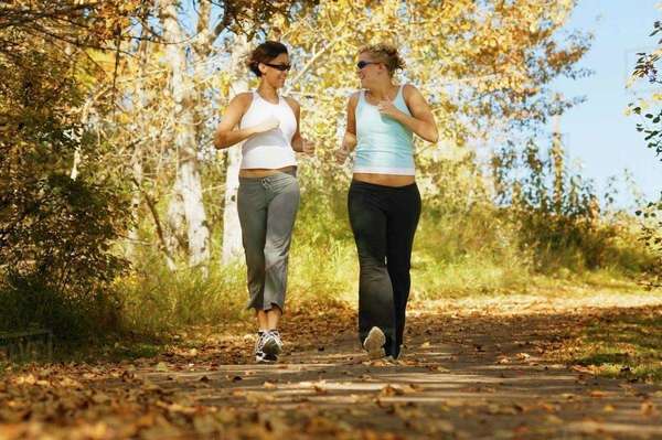 Two Women Running - Stock Photo - Dissolve