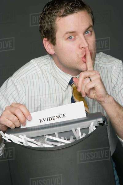 Man Shredding Evidence - Stock Photo - Dissolve