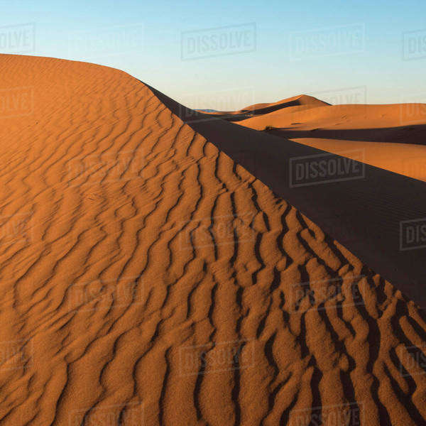 Sand slopes and ridges with a blue sky - Royalty-free Stock Photo ...