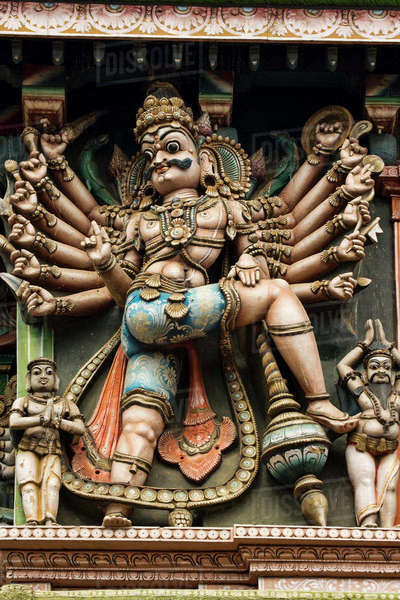 Hindu god with many arms at the Meenakshi Temple, India; Madurai, India ...