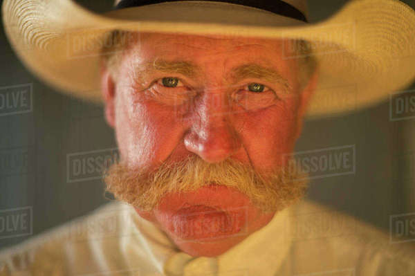 Portrait of a rancher wearing a cowboy hat; Burwell, Nebraska, United ...
