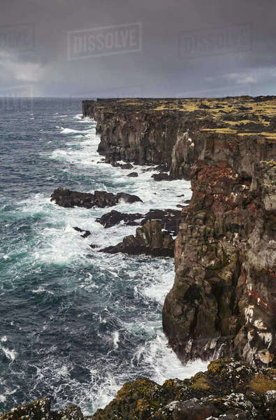 Lava cliffs at Skalasnagi, at the northwestern tip of the Snaefellsnes ...