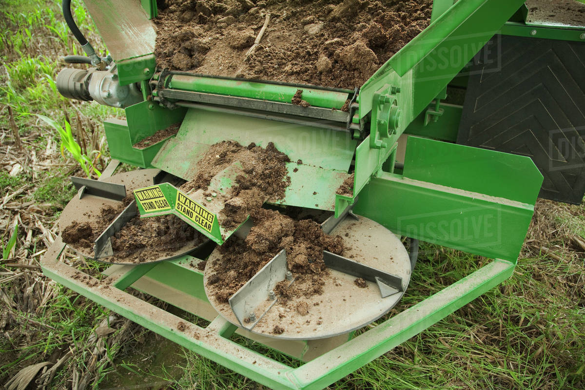 Agriculture - Spinners on a spreader wagon loaded with poultry litter ...
