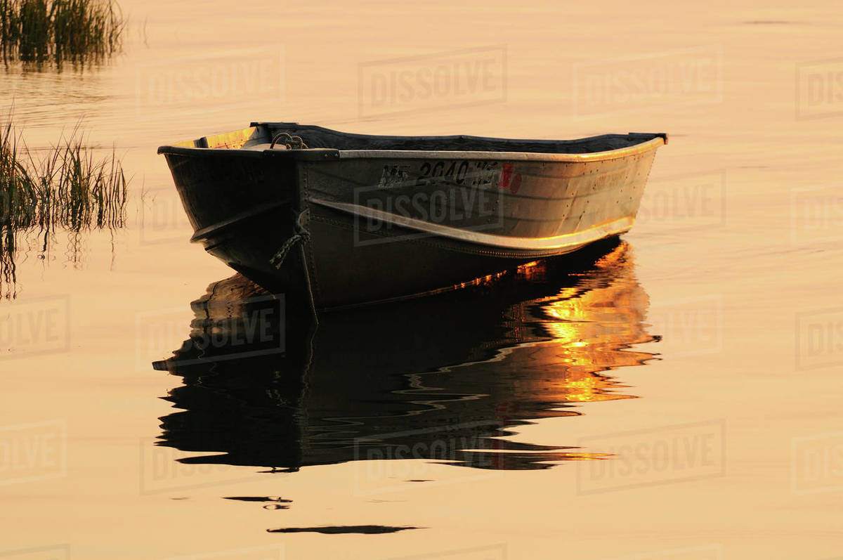 A dinghy at dawn.; Orleans, Cape Cod, Massachusetts. - Royalty-free ...