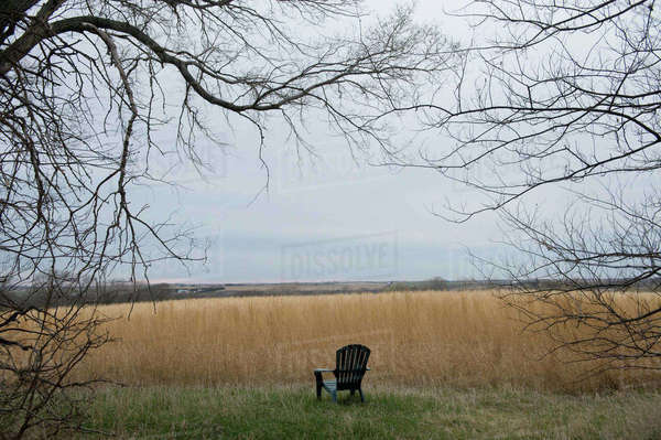 Lone chair on the edge of a tall grass prairie near Walton, Nebraska ...