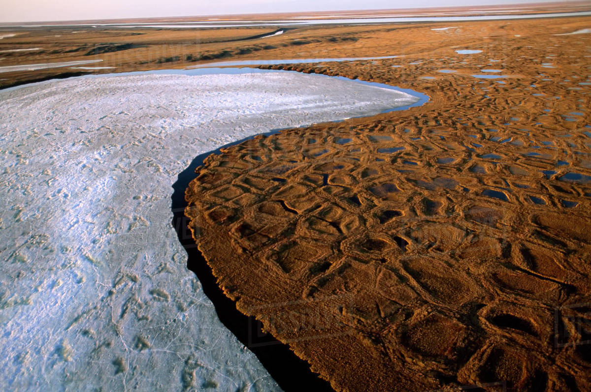 Melting ice, pools and rivers in the Arctic tundra; North Slope, Alaska ...