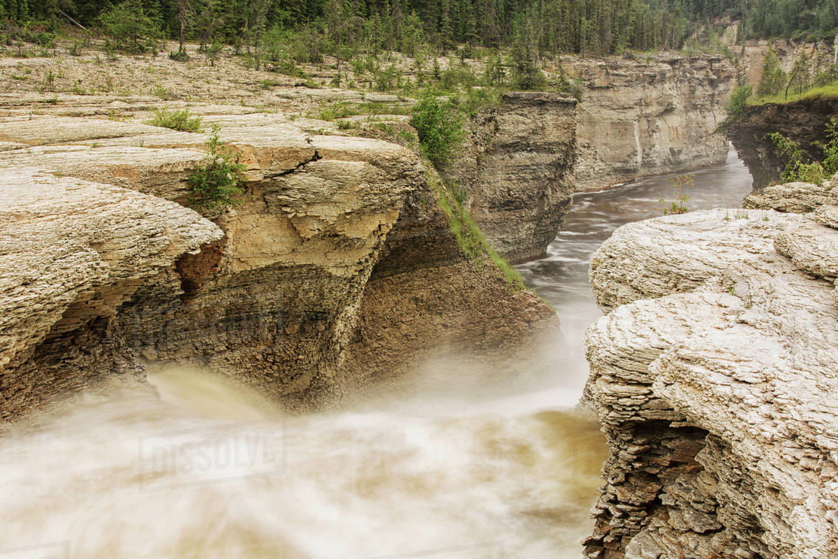 The Trout River flows over whittaker Falls; Northwest Territories ...