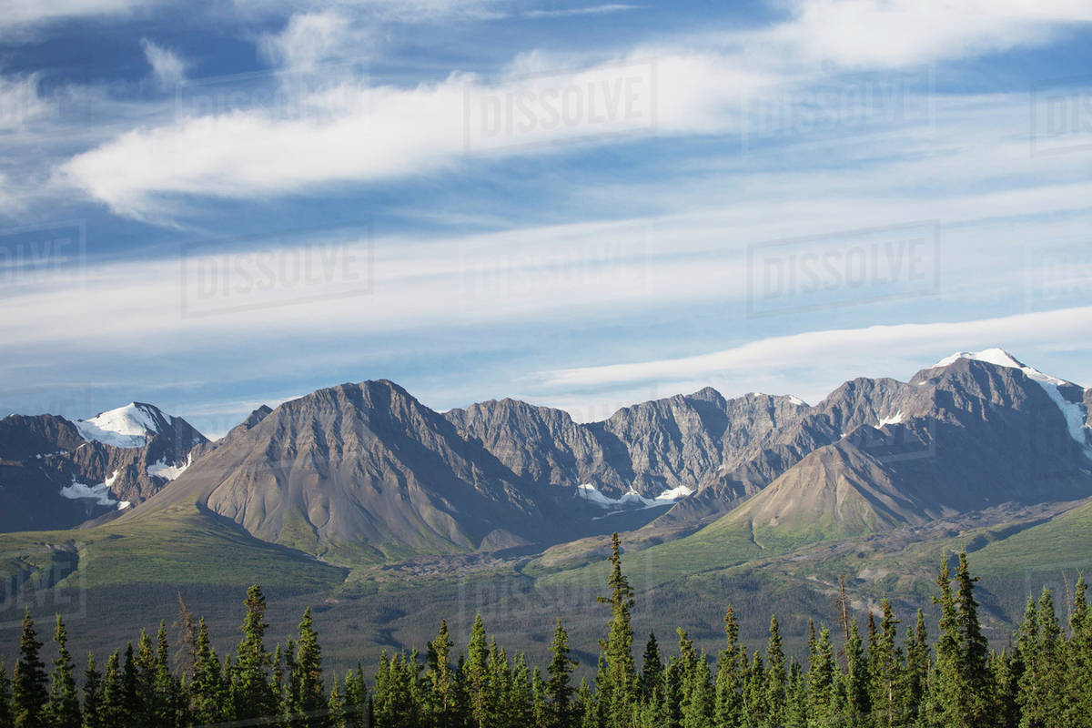 Rugged mountain range and forest; Haines Junction, Yukon, Canada ...