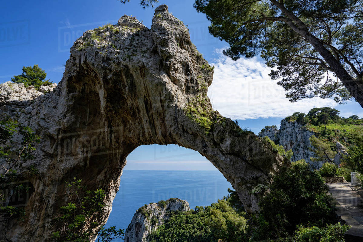 View through the Arco Naturale, a Palaeolithic era limestone arch ...