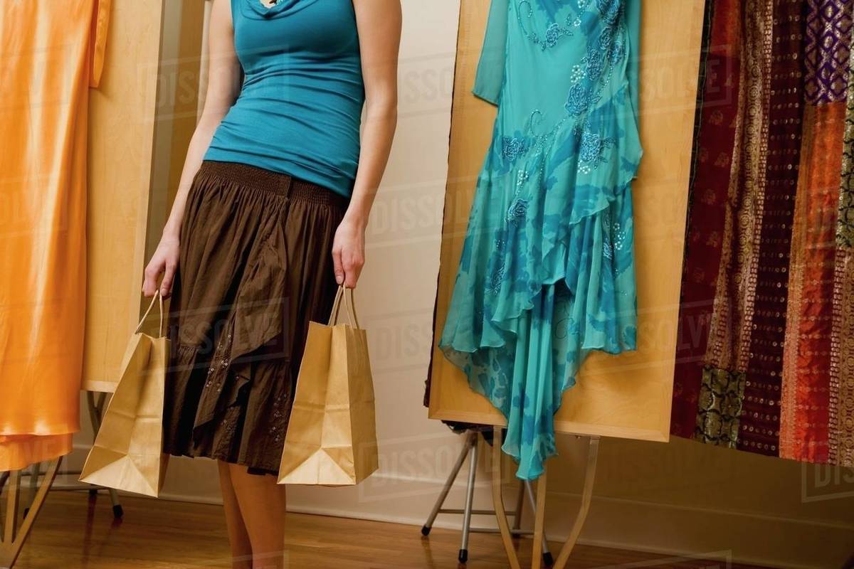 Woman Standing In Dressing Room With Shopping Bags - Royalty-free Stock ...