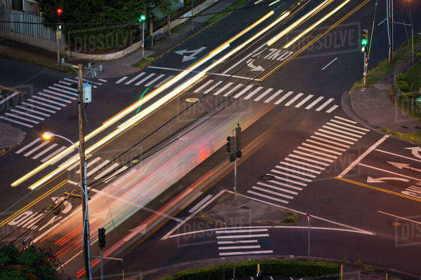 High angle view of an intersection with painted arrows and crosswalks ...