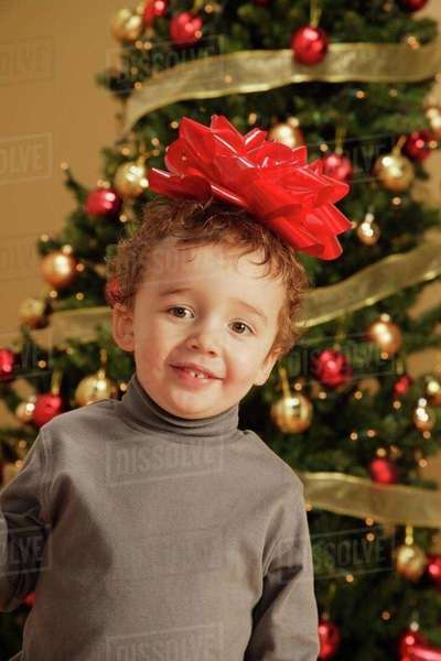 Child With Bow On His Head - Stock Photo - Dissolve