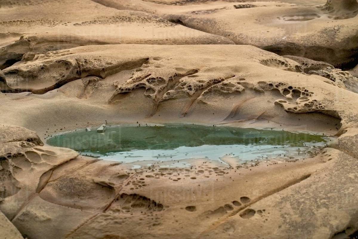 Pool Of Water In Rock - Stock Photo - Dissolve