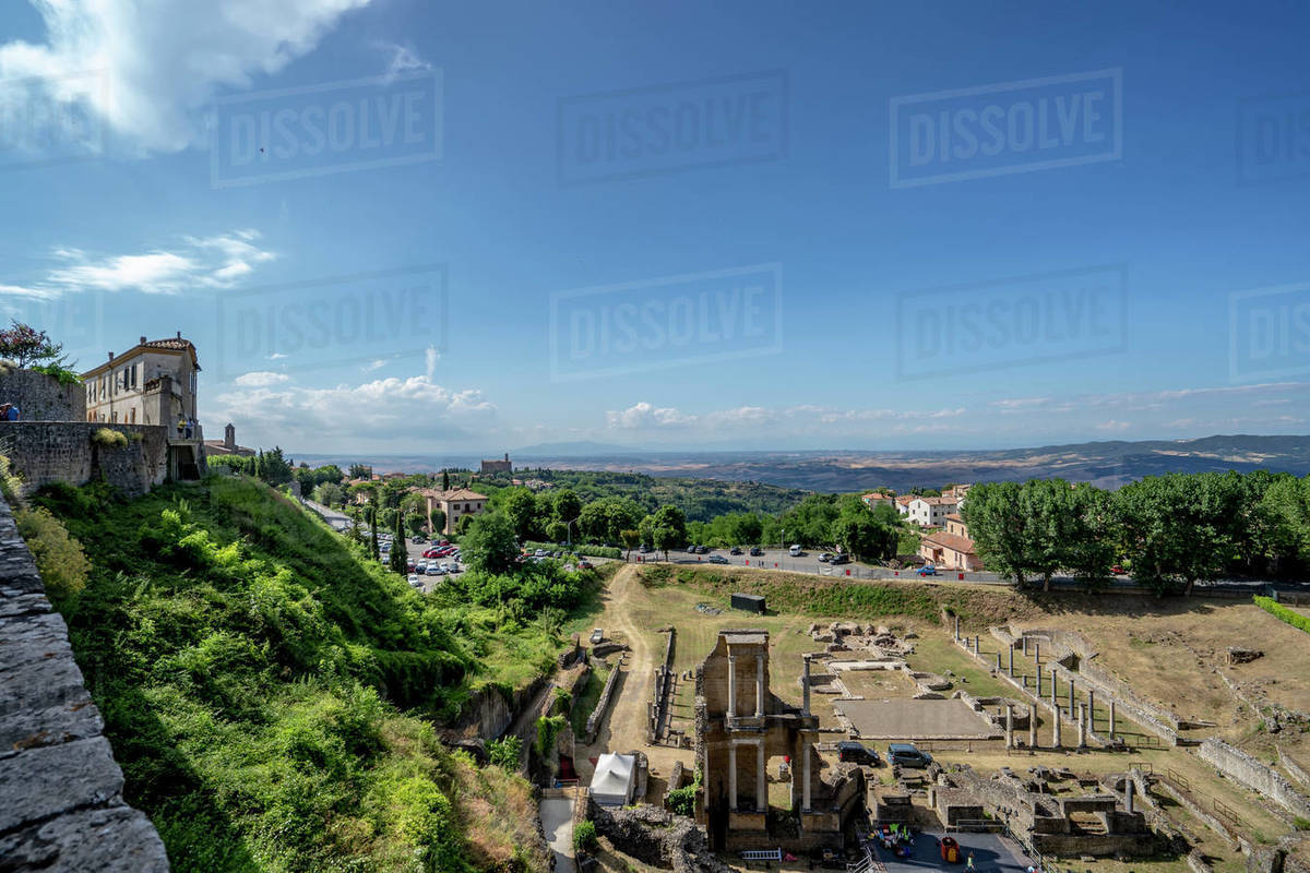 Overview of the historic old town of Volterra and the Roman ruins of ...