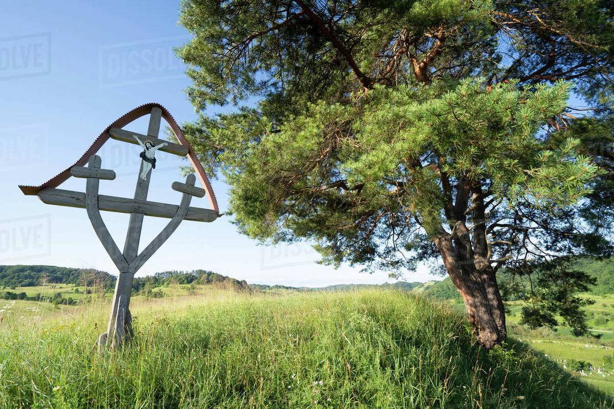 Christian cross on a hilltop in the medieval Saxon village of Copsa ...