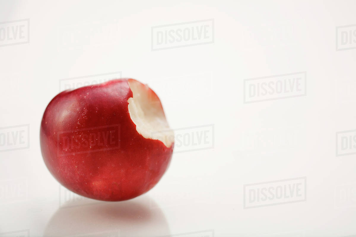 Organic Apple With Bite Taken Out - Royalty-free Stock Photo | Dissolve