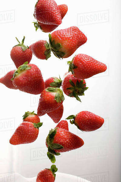 Strawberries Falling - Stock Photo - Dissolve