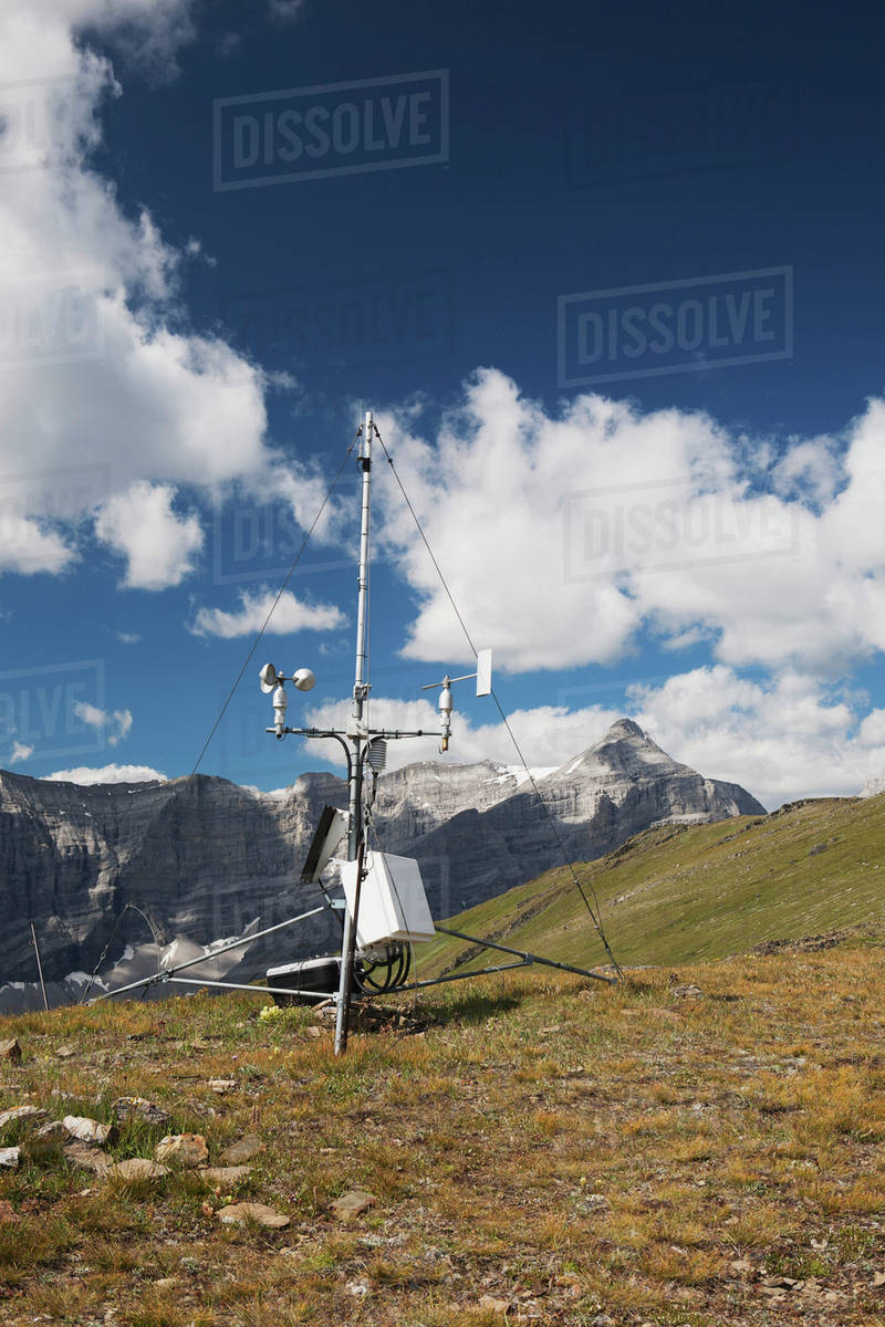 A Weather Station On Top Of A Ridge With Mountains In The Distance And ...