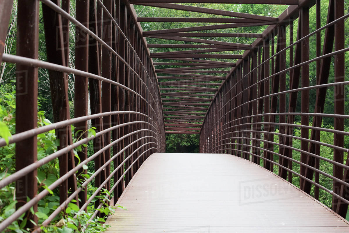 An Arched Bridge Covered With Metal Top And Metal Railings; Port ...