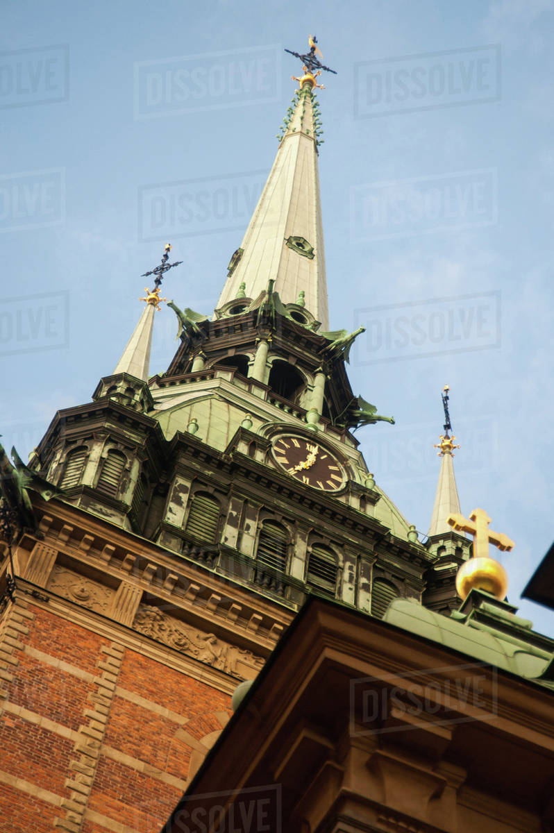 Clock Tower And Crosses At The Top Of A Building In Old Town; Stockholm ...