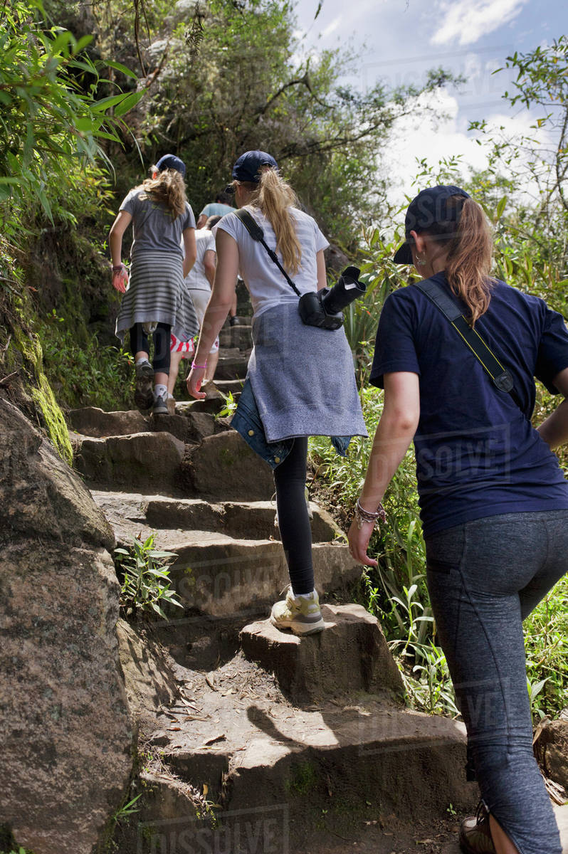Girls Climbing Stone Steps At Machu Picchu; Peru - Royalty-free Stock ...