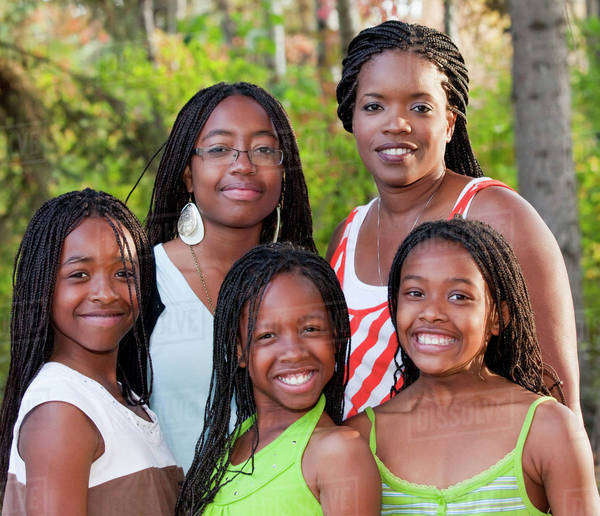 Portrait Of A Mother With Four Daughters In A Park; Edmonton, Alberta ...