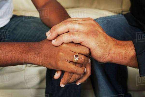 Man's Hands Clasped For Prayer With Other Hand On Top Showing Support ...