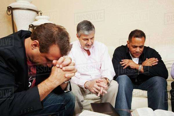 Men Praying Together - Royalty-free Stock Photo | Dissolve