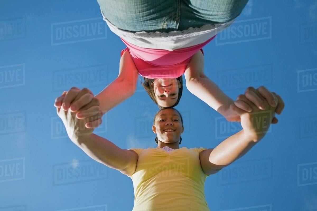 Two Girls Putting Their Head Together - Royalty-free Stock Photo | Dissolve
