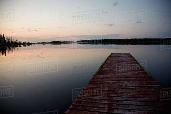 Saskatchewan, Canada; A Dock Going Out To Anglin Lake - Royalty-free ...