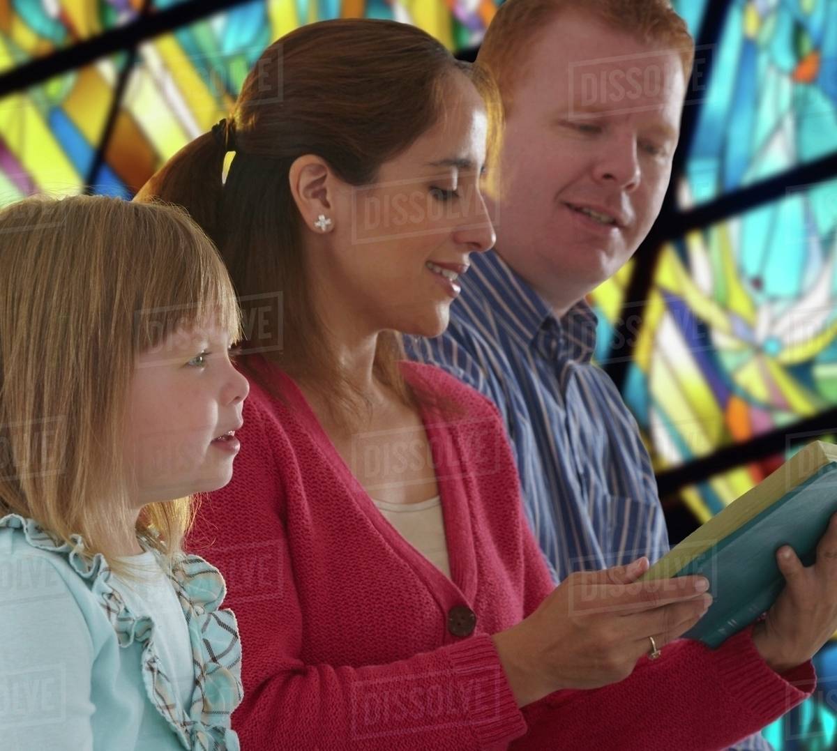 A Family Reading The Bible Together In Church - Royalty-free Stock ...