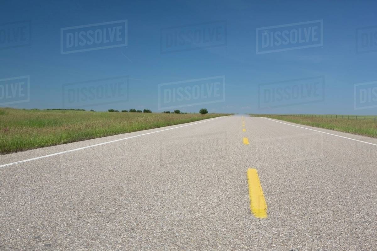 Paved Road With Yellow Stripe Lines; Alberta, Canada - Royalty-free ...