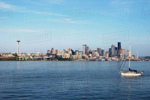Seattle Skyline And A Sailboat In The Water; Seattle, Washington ...