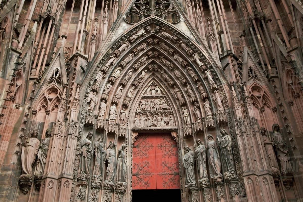 Grand Arched Gothic Entrance To A Cathedral With Statues; Strasbourg ...