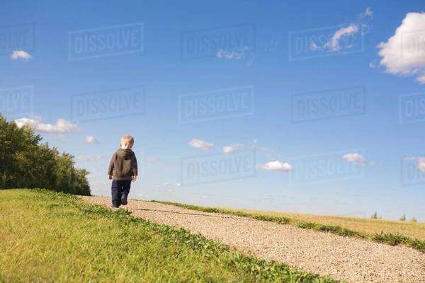 Child Walking On A Path - Royalty-free Stock Photo | Dissolve