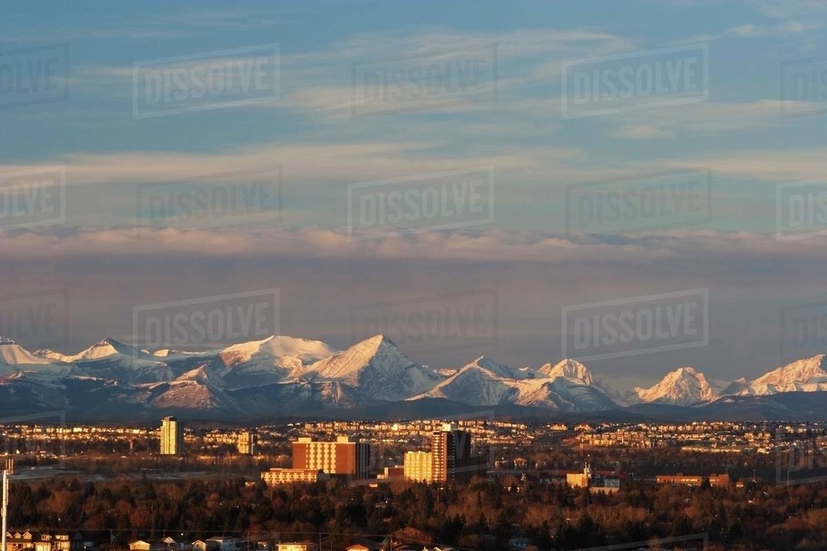 City Skyline With Mountain Backdrop, Calgary, Alberta, Canada - Royalty ...