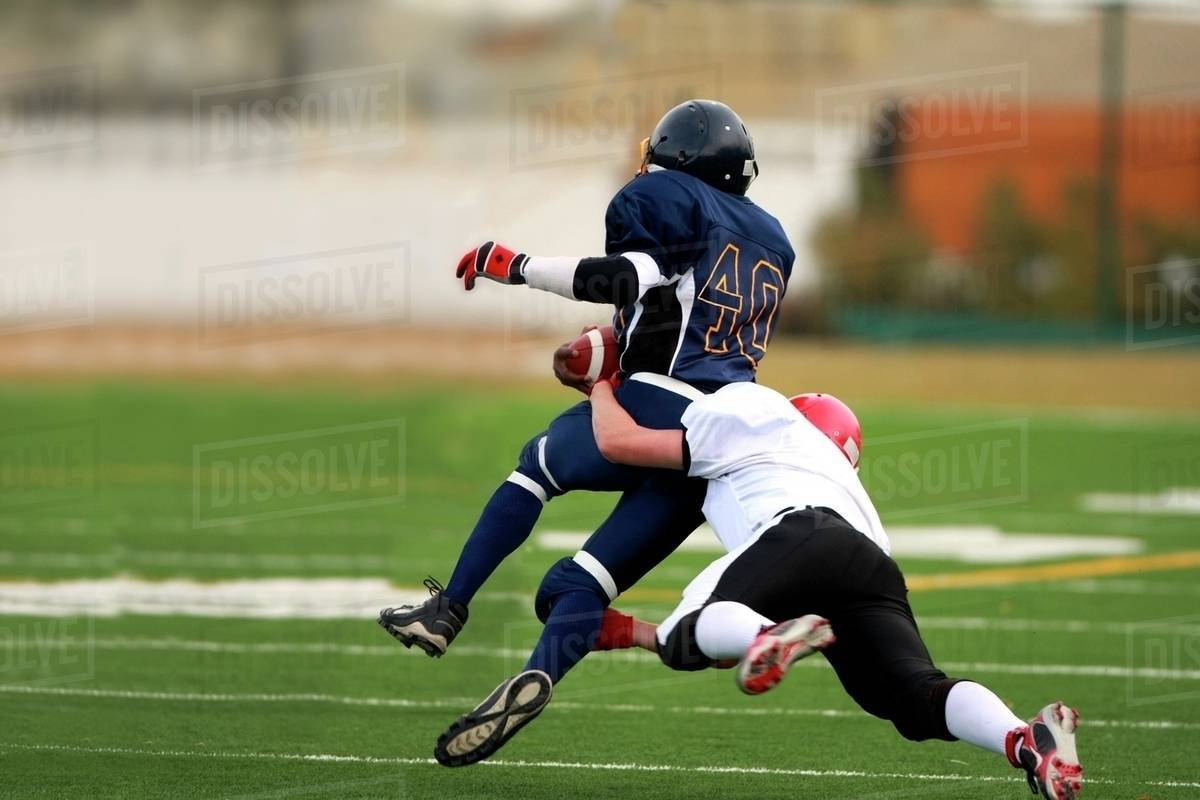 Football Tackle - Stock Photo - Dissolve