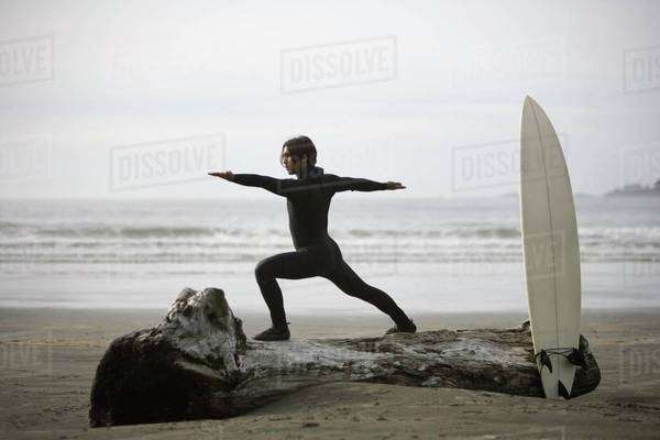 Surfer Stretching On Beach, Cox Bay Near Tofino, British Columbia ...