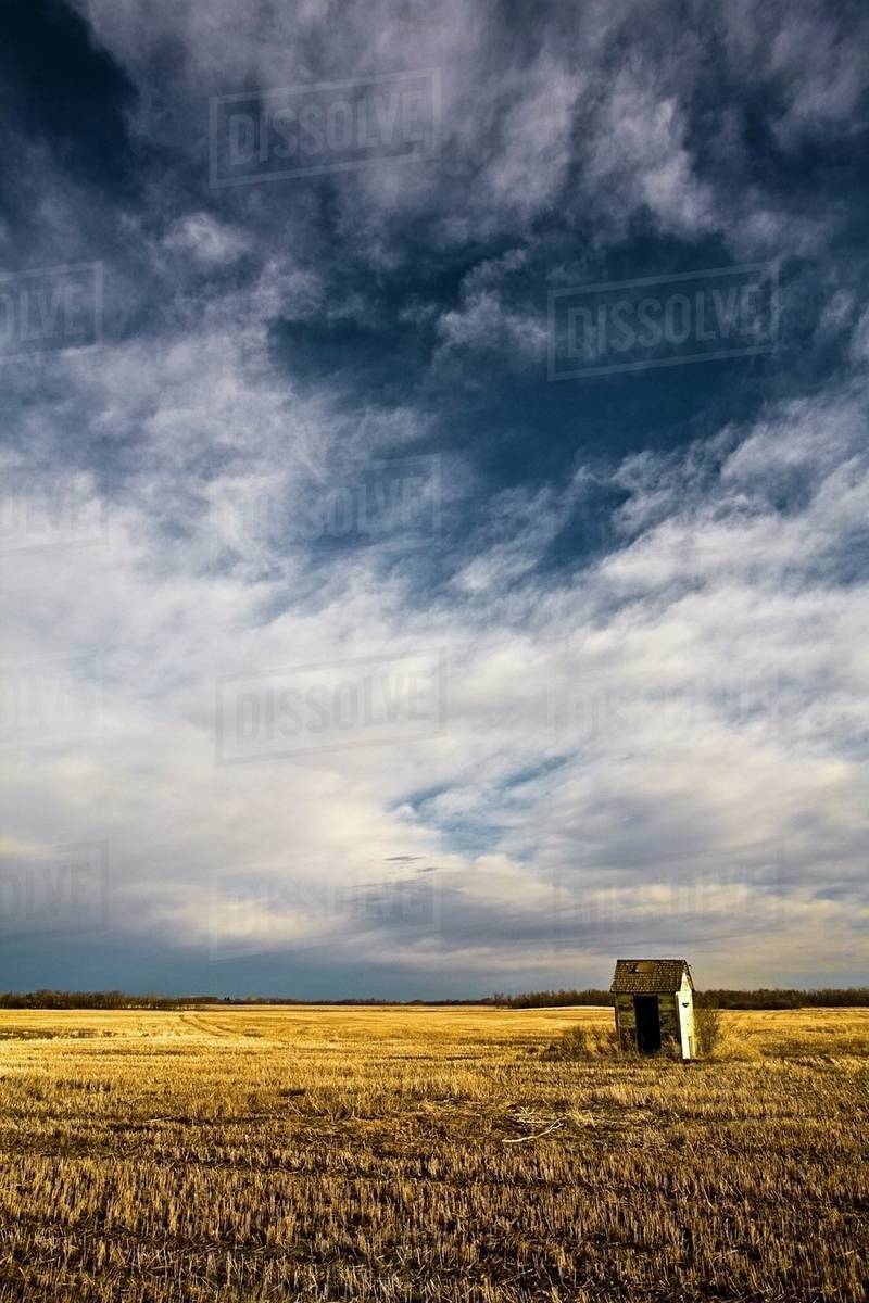 Shack In Field - Stock Photo - Dissolve
