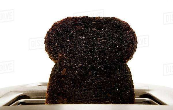 Burnt Toast In Toaster - Royalty-free Stock Photo | Dissolve