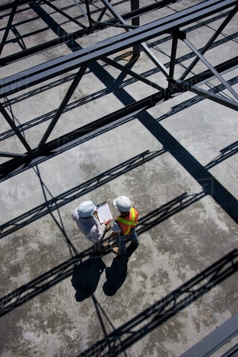 High Angle View Of Engineers On Building Site - Stock Photo - Dissolve