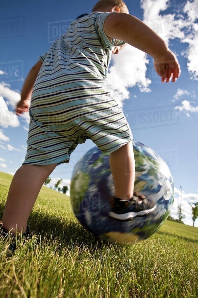 Child Playing With Ball - Stock Photo - Dissolve