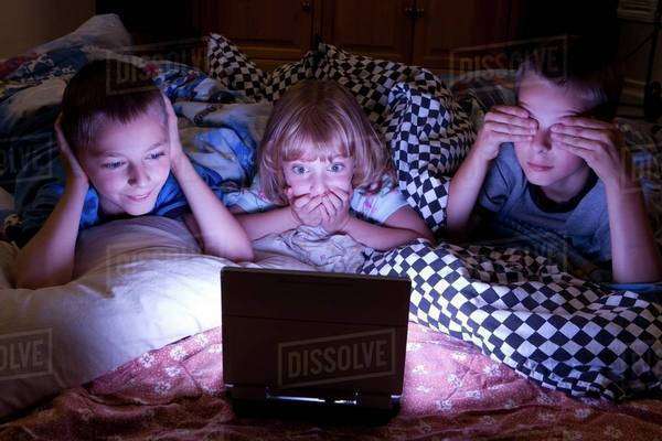 Kids Watching Scary Movie - Royalty-free Stock Photo | Dissolve