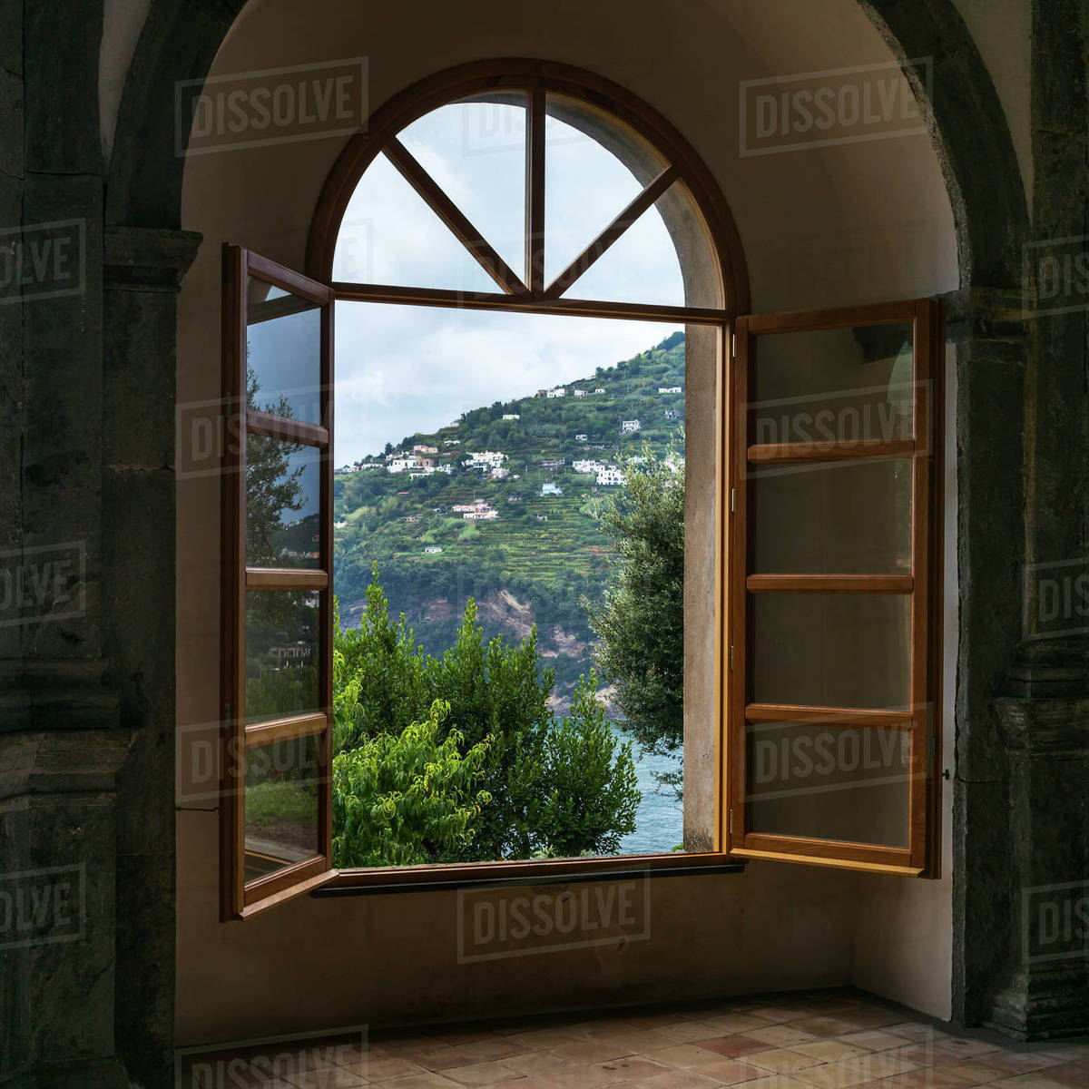 View through an open window at Aragonese Castle to Ischia island ...