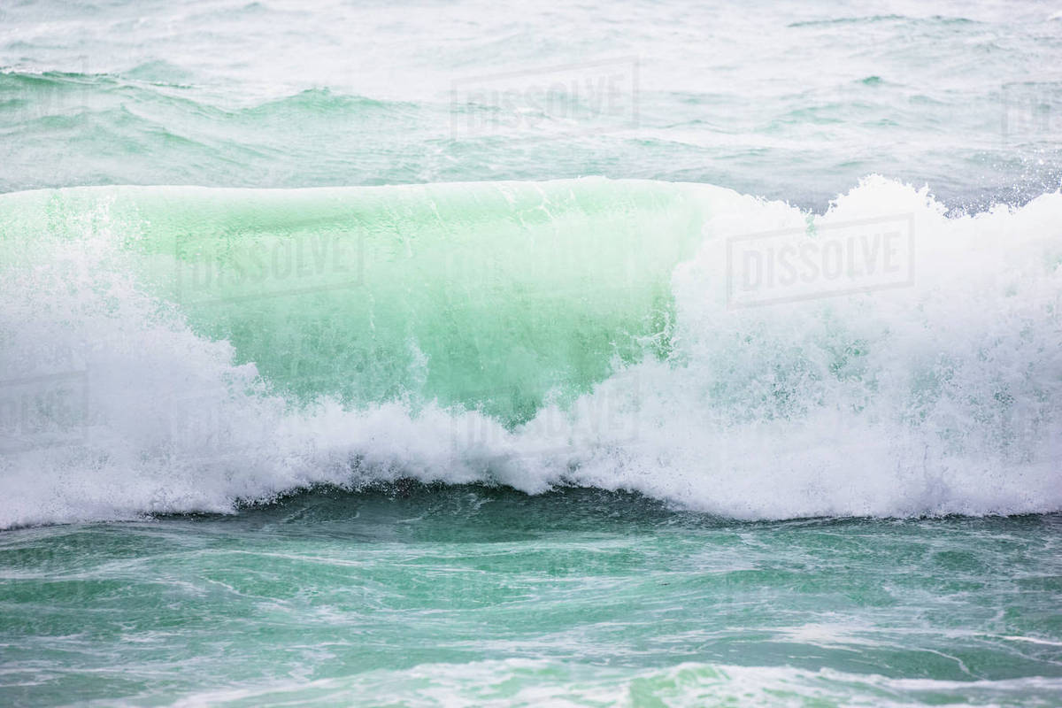 Wave breaking on the shore of St. Paul Island, Bering Sea, Southwestern ...
