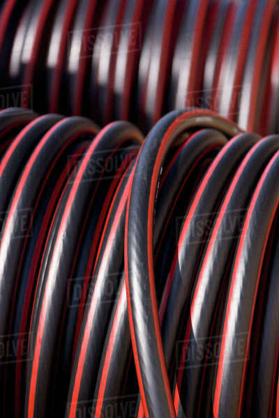 Detail of large diameter cable coiled on wooden spools at an electrical ...