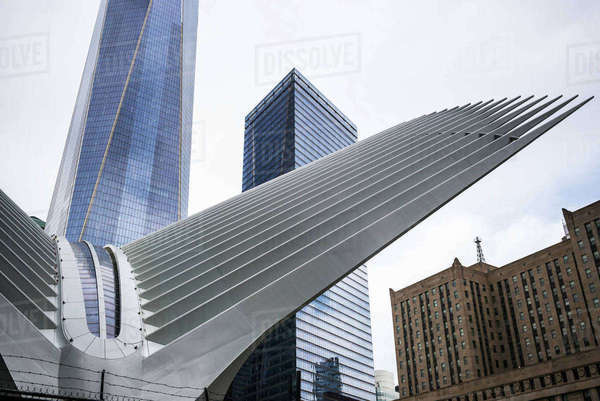 Modern structure with white prongs like wings, skyscraper and One World ...