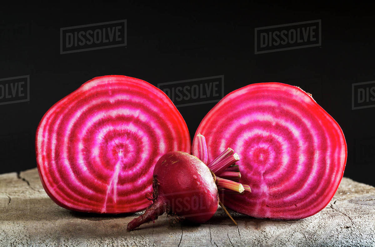 Close Up Of A Cut Red And White Striped Beet With An Uncut Small Beet ...
