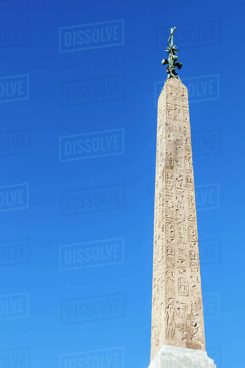 Obelisk With Statue On Top And Etchings On Facade; Rome, Italy ...